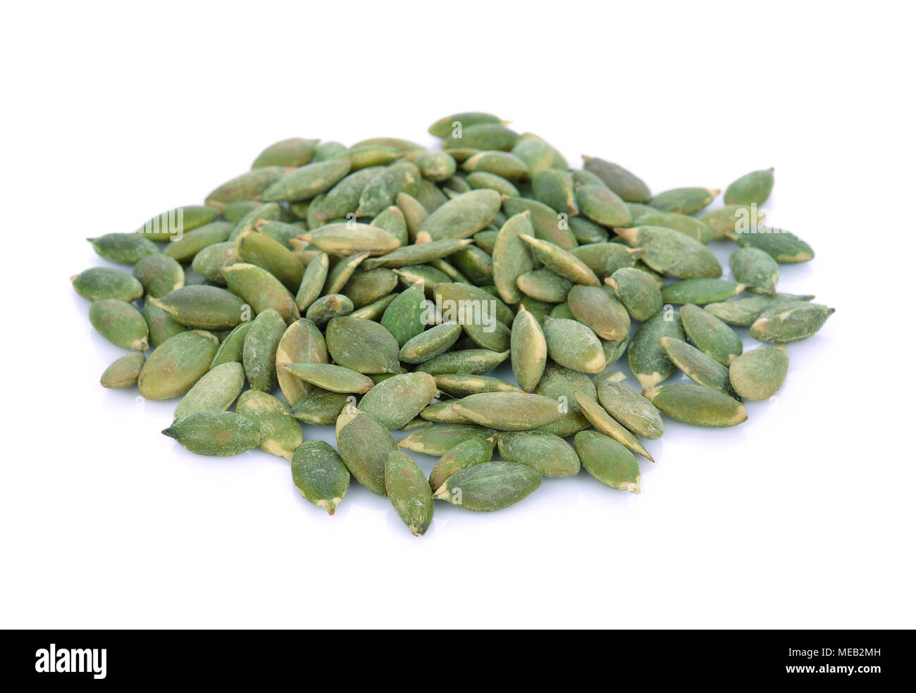 Pumpkin seeds on white background Stock Photo - Alamy