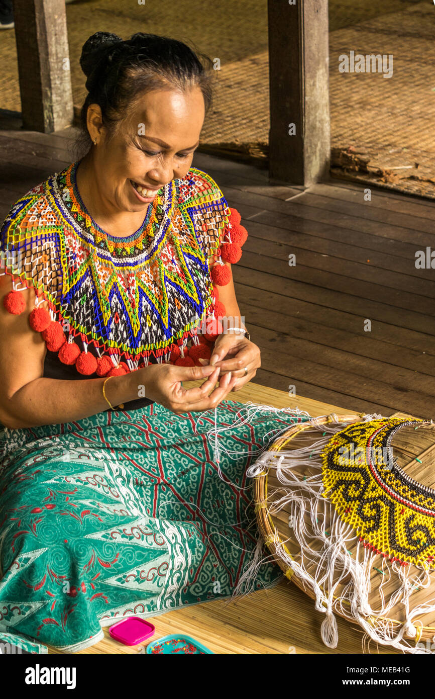 Working at arts and crafts in cultural village Sarawak Malaysia Borneo ...