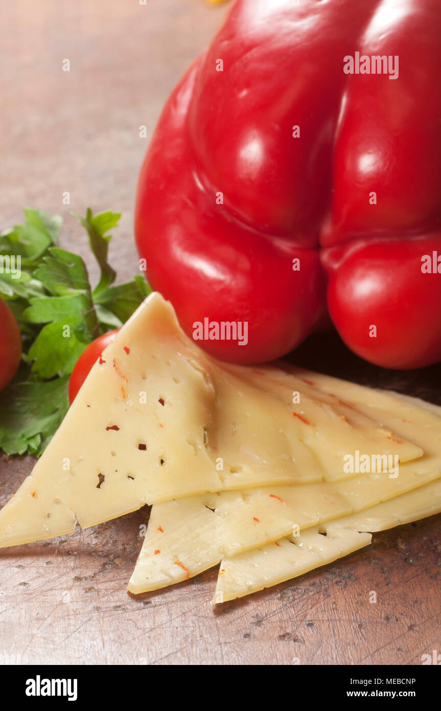 Cheese on a timber board, closeup Stock Photo - Alamy