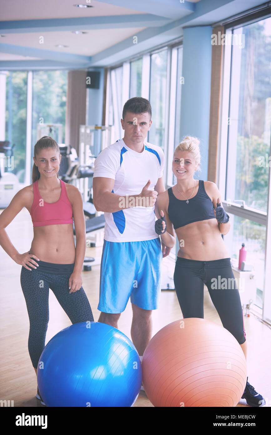 group portrait of healthy and fit young people in fitness gym Stock ...