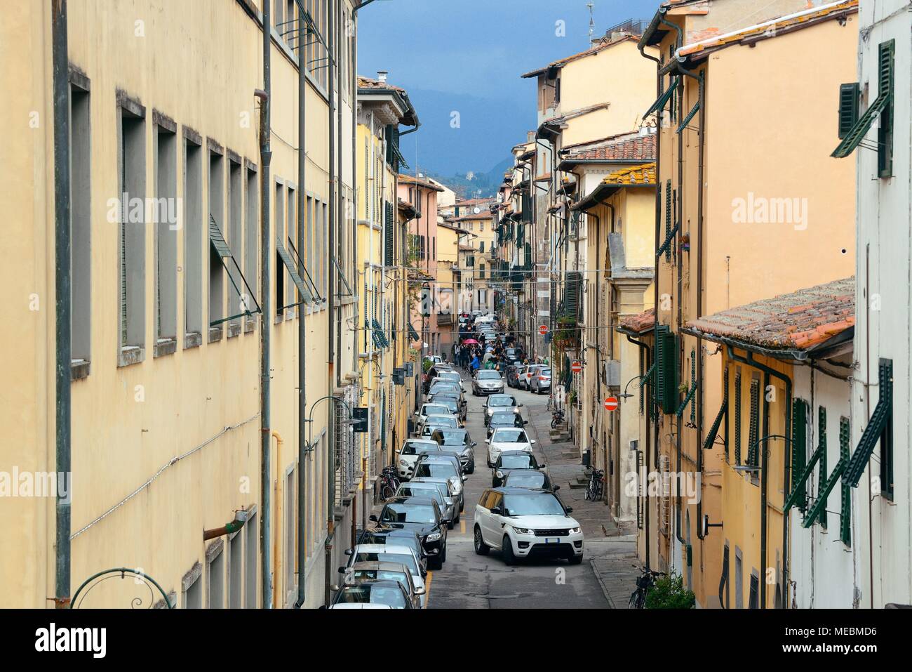 Lucca street view with cars in Italy Stock Photo - Alamy