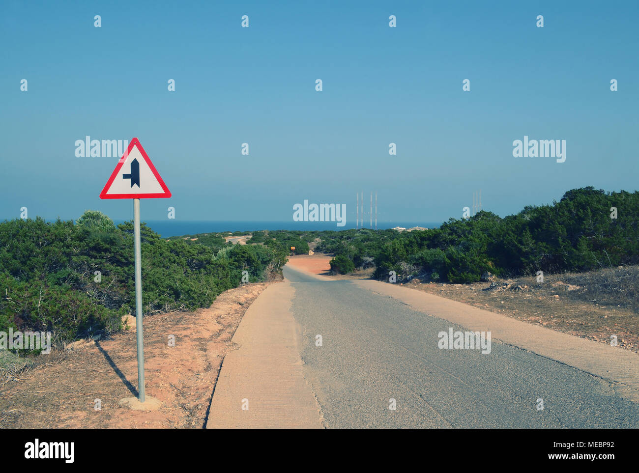 Road turn signal on the road to the sea in Cyprus on the cape Greco ...