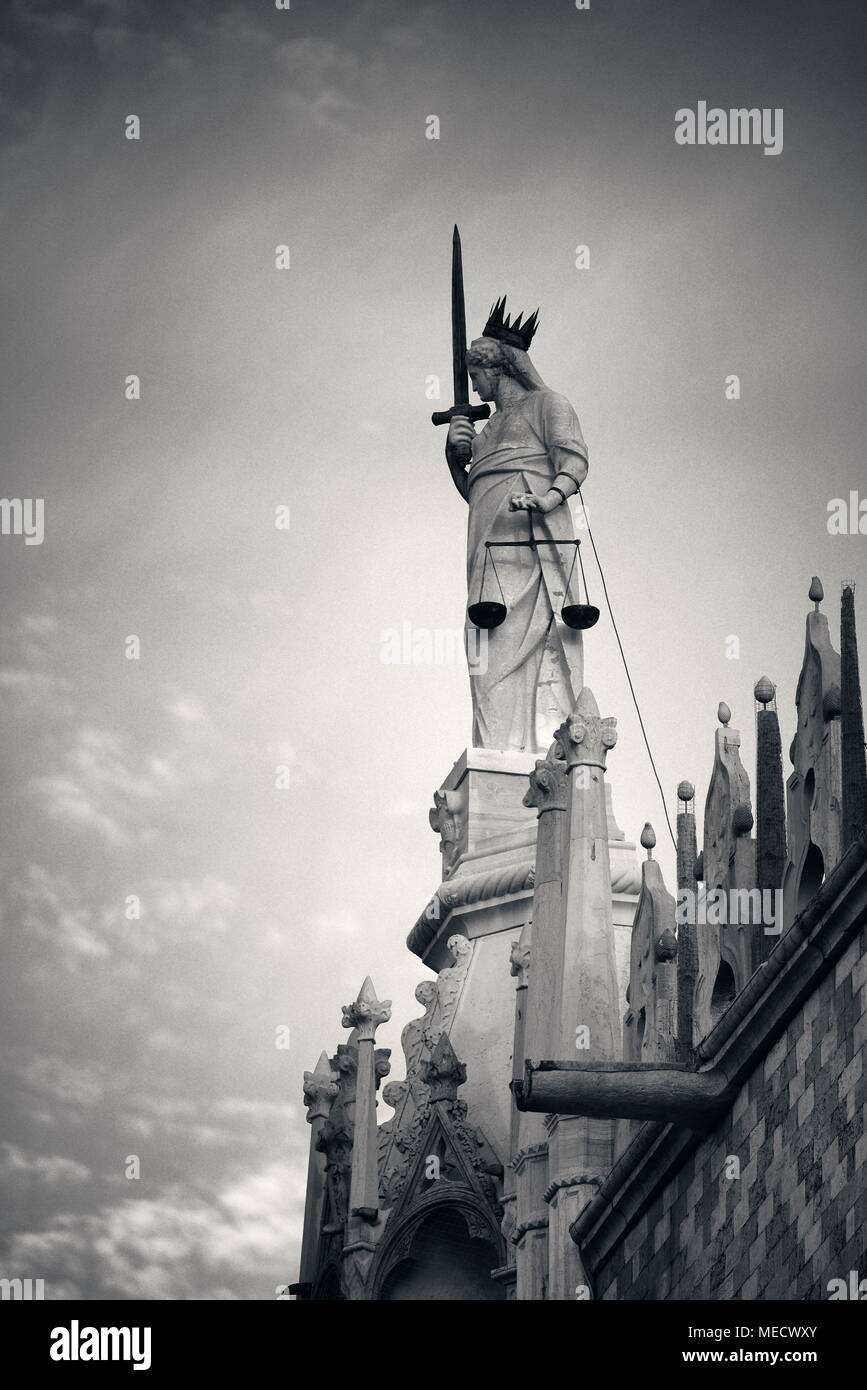 Statue on roof of historical buildings in Venice, Italy Stock Photo - Alamy