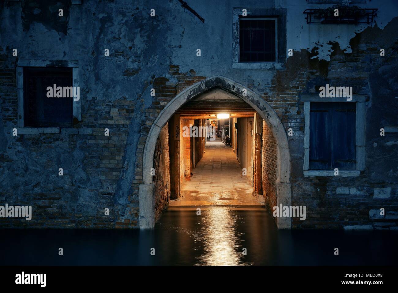 A walkway leading to street at night in Venice. Italy Stock Photo - Alamy