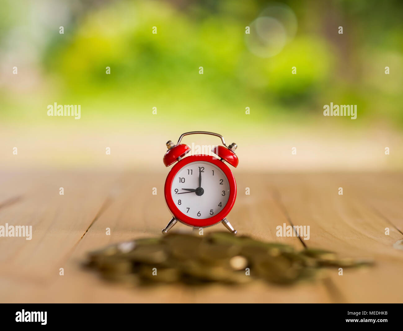 Alarm clock and piggy bank concept for saving time Stock Photo - Alamy