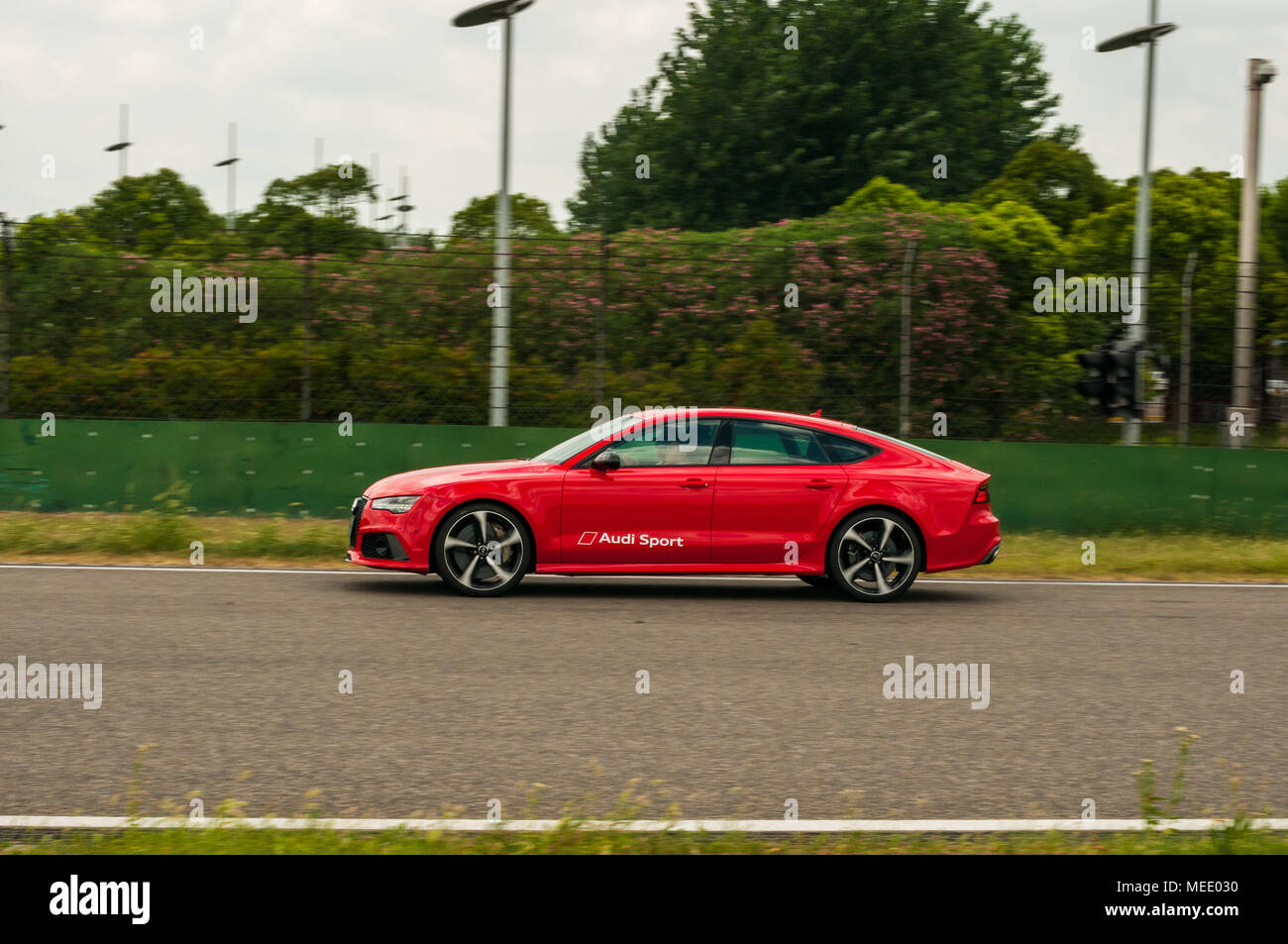 A red RS7 Sportback Performance being used for cornering practice at an ...