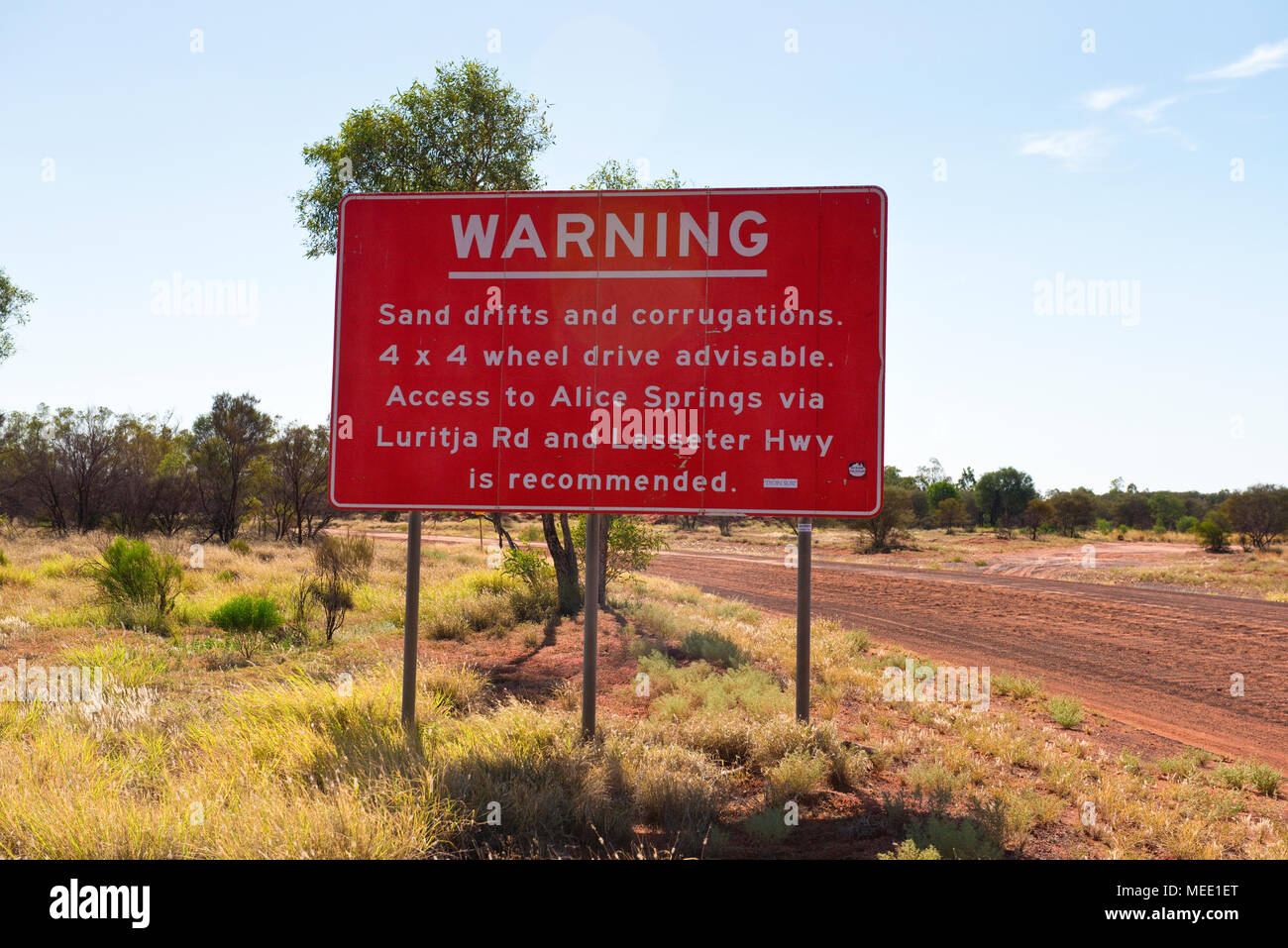 Warning sign at entrance to unsealed road advising that only suitable ...