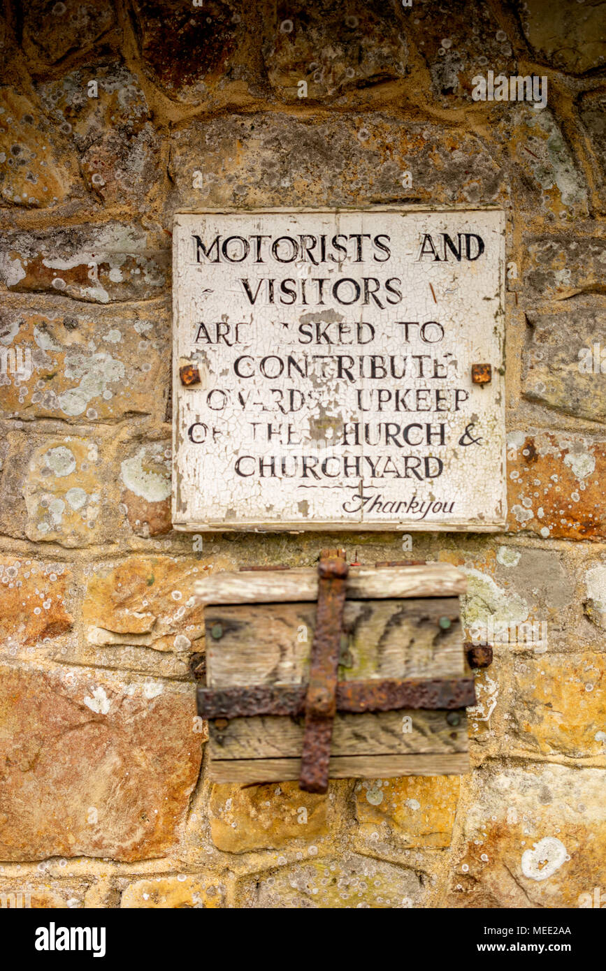 Old traditional donation sign in carpark in Amberley in West Sussex ...
