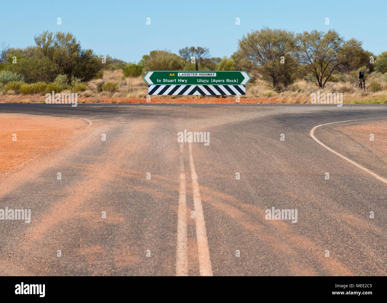 Road sign on Lasseter Highway to Stuart Highway or Uluru (Ayers Rock ...