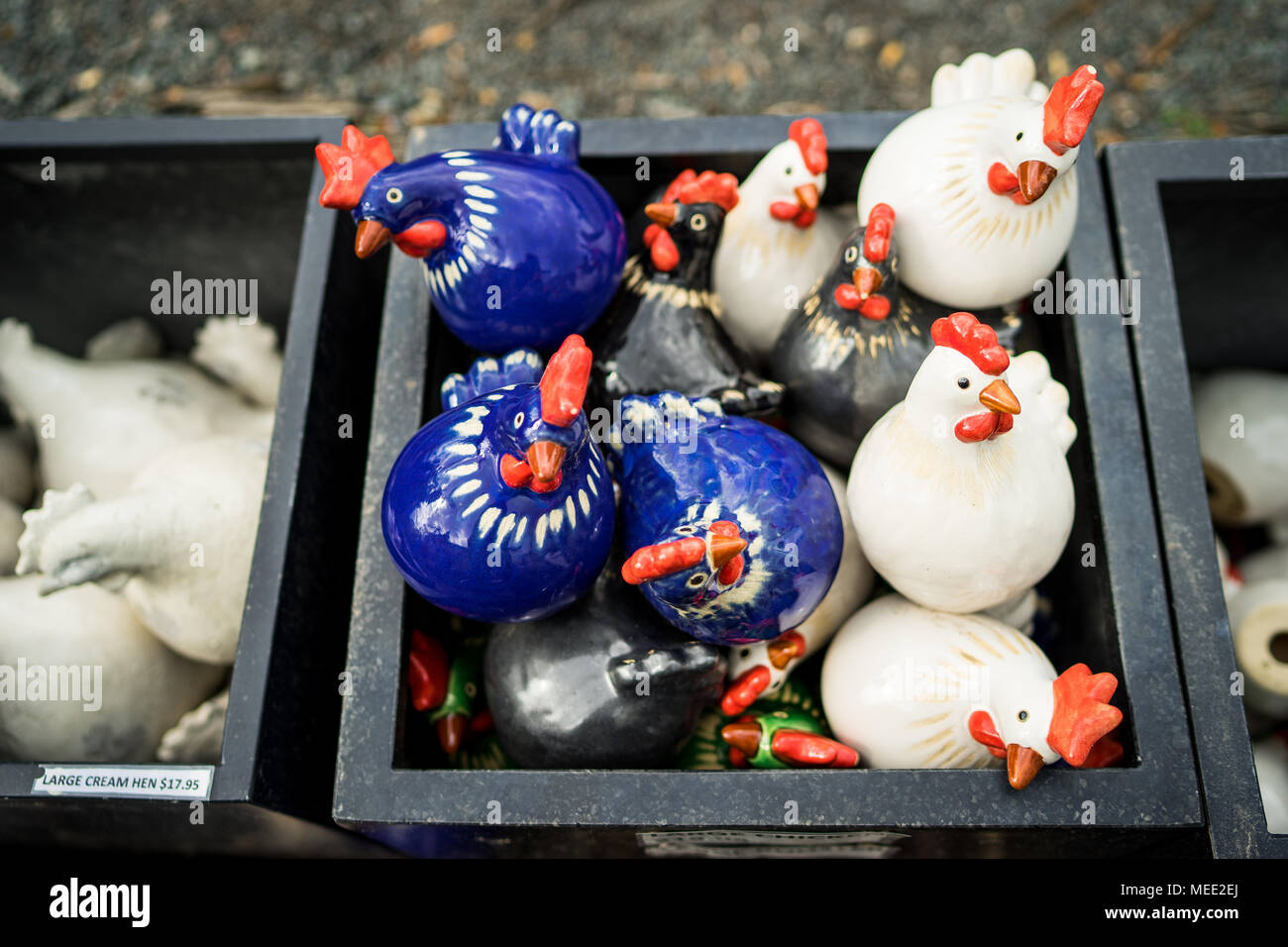Ceramic chickens in a box for sale at a nursery Stock Photo - Alamy
