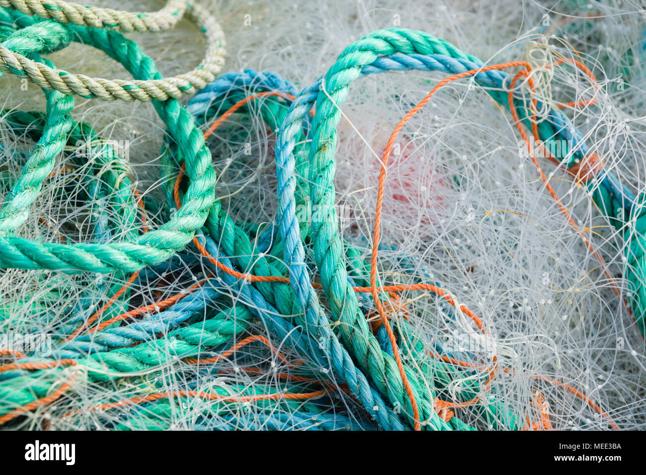 A tangled mess of fishing nets plastic rope and other debris washed up ...