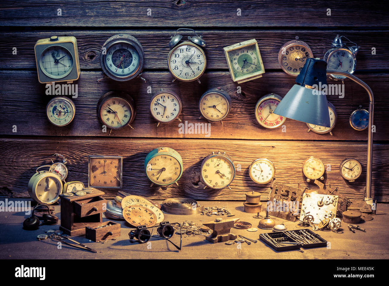Watchmaker's workshop with many clocks, tools and spare parts Stock ...