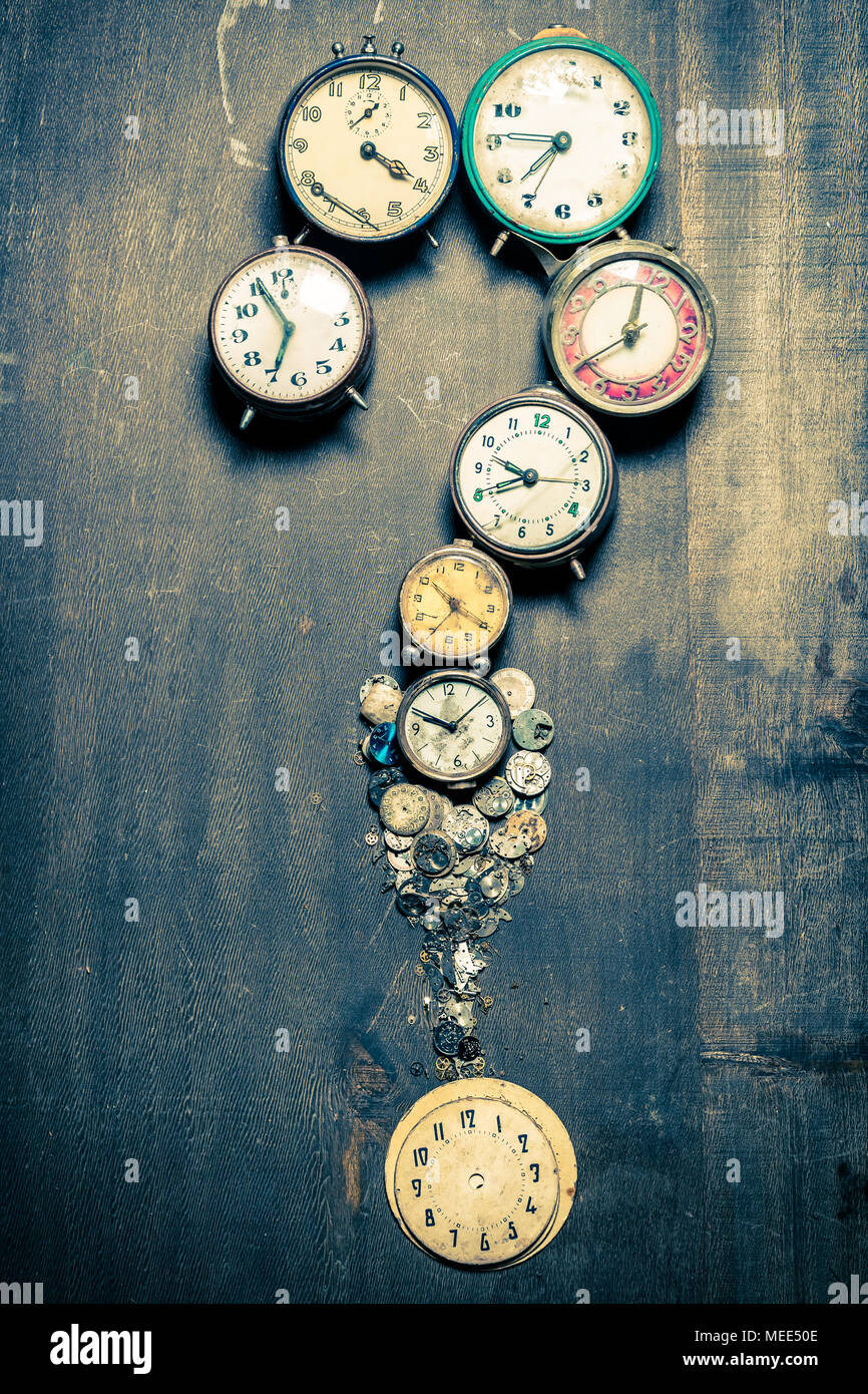 Questions mark made of old clocks and spare parts Stock Photo - Alamy