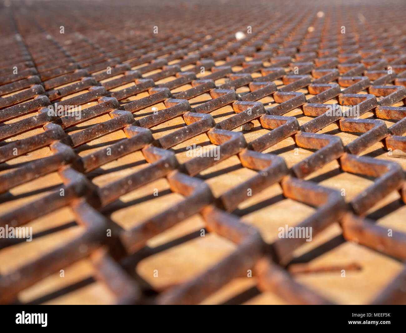 Low Angle Picture of Rusted Iron Pattern on Concrete Stock Photo - Alamy