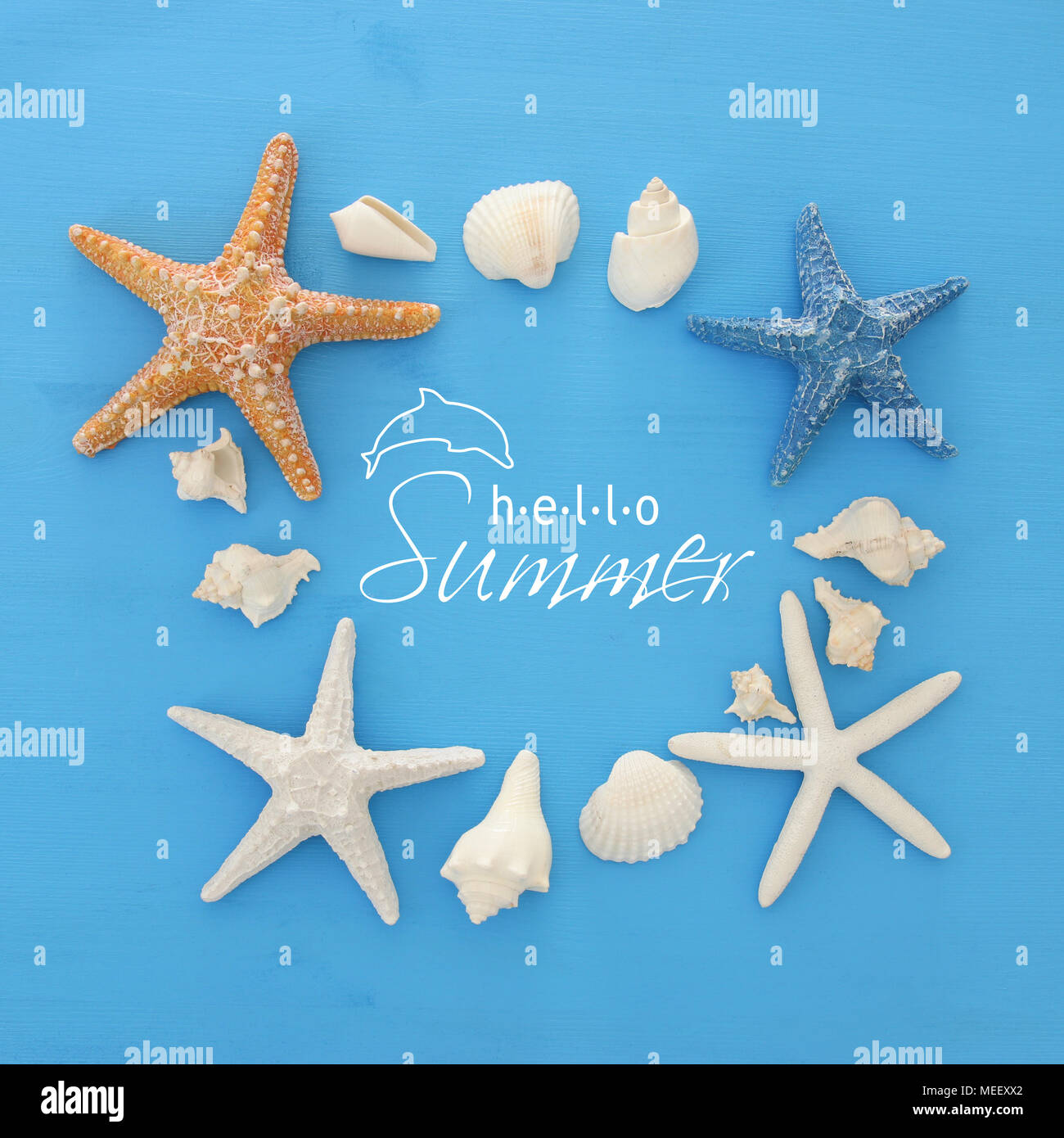nautical and summer holidays concept with seashells and starfish over ...