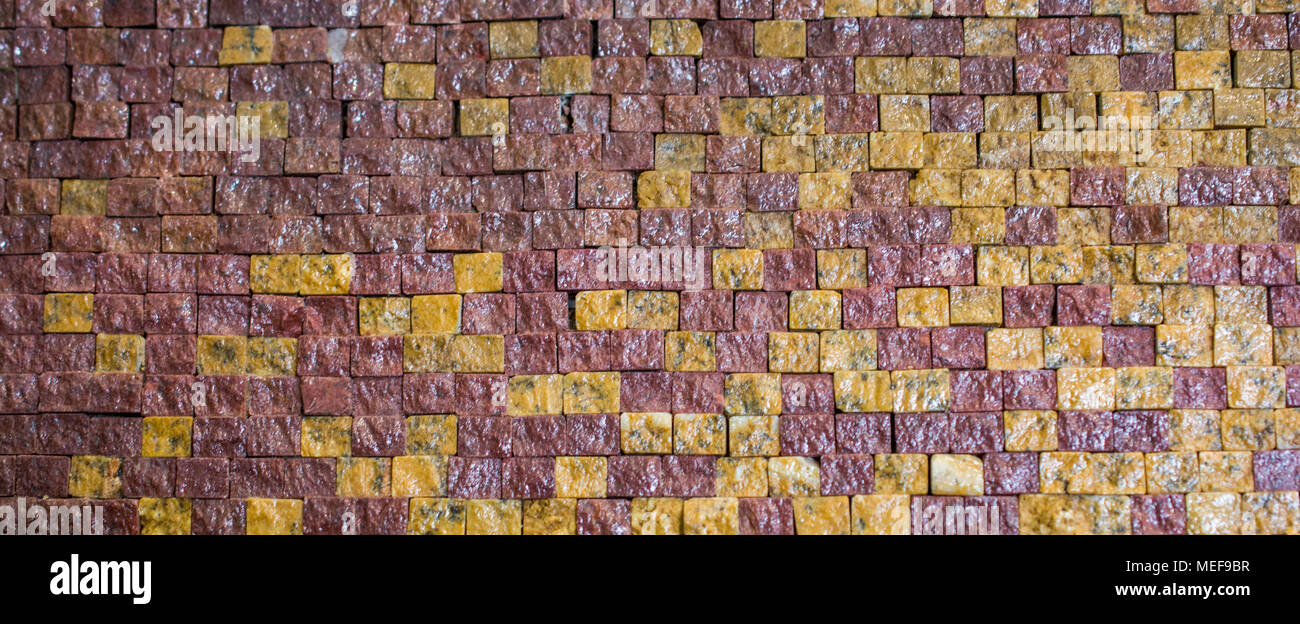 Decorative stone background built of little stones Stock Photo - Alamy