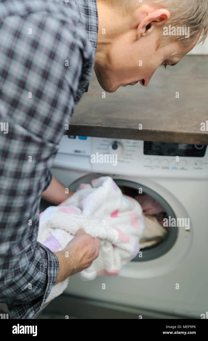 Man loading detergent washing hi-res stock photography and images - Alamy