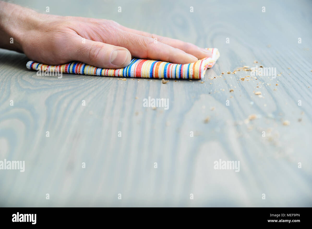 Mans hand rag wipes dust hi-res stock photography and images - Alamy