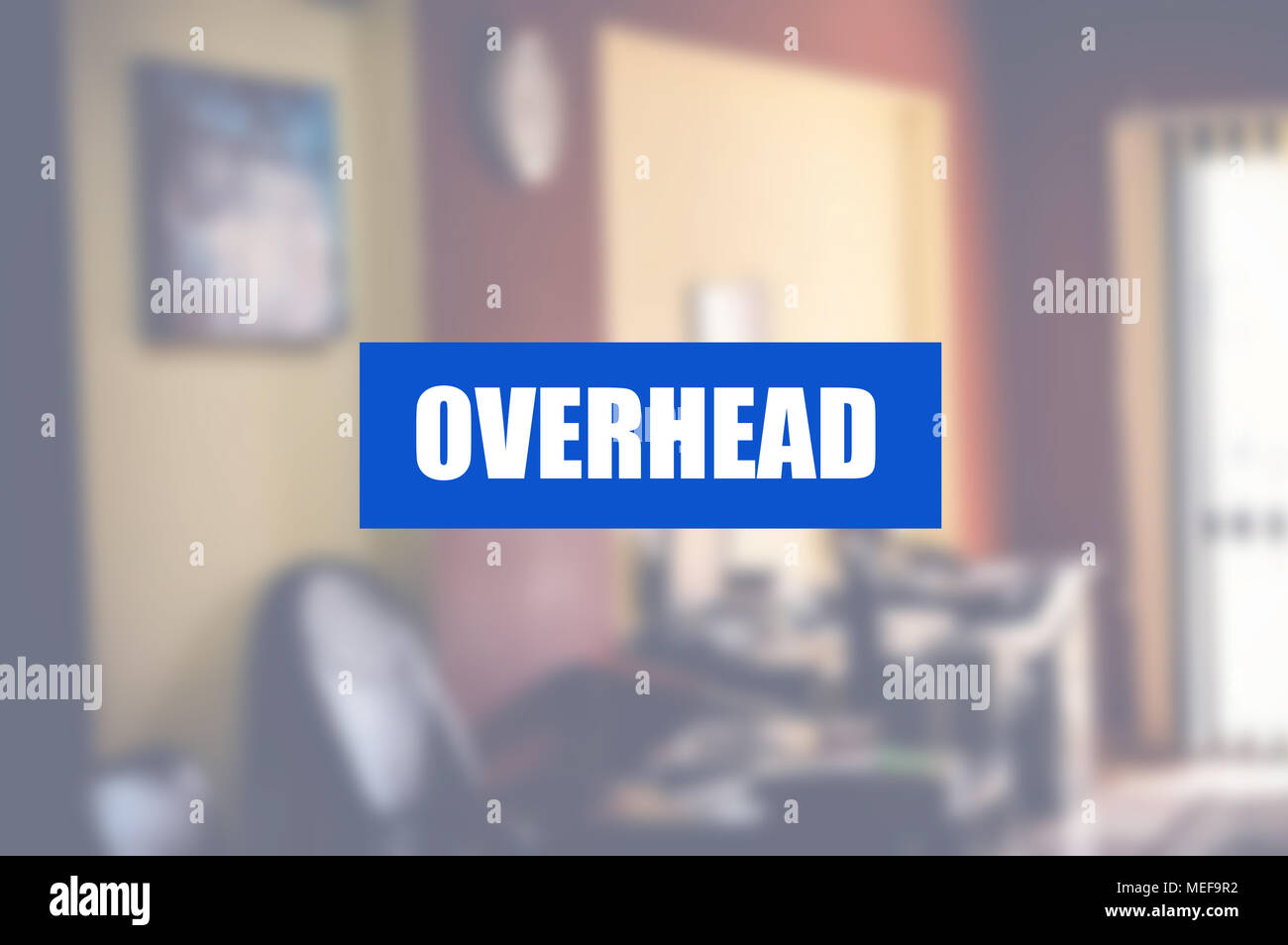 Overhead word with business blurring background Stock Photo - Alamy