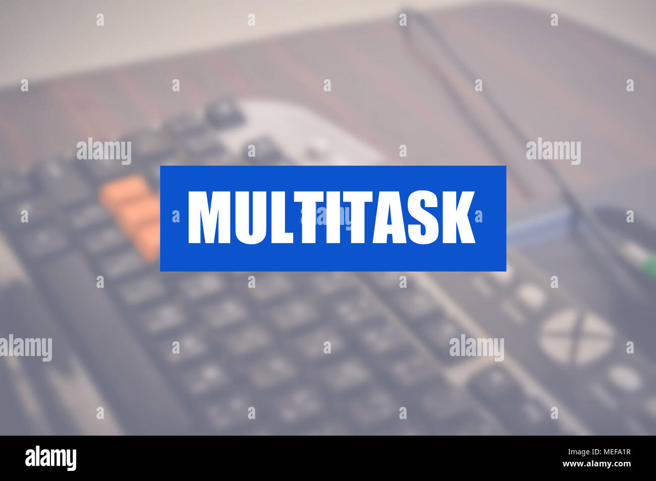 Multitask word with business blurring background Stock Photo - Alamy