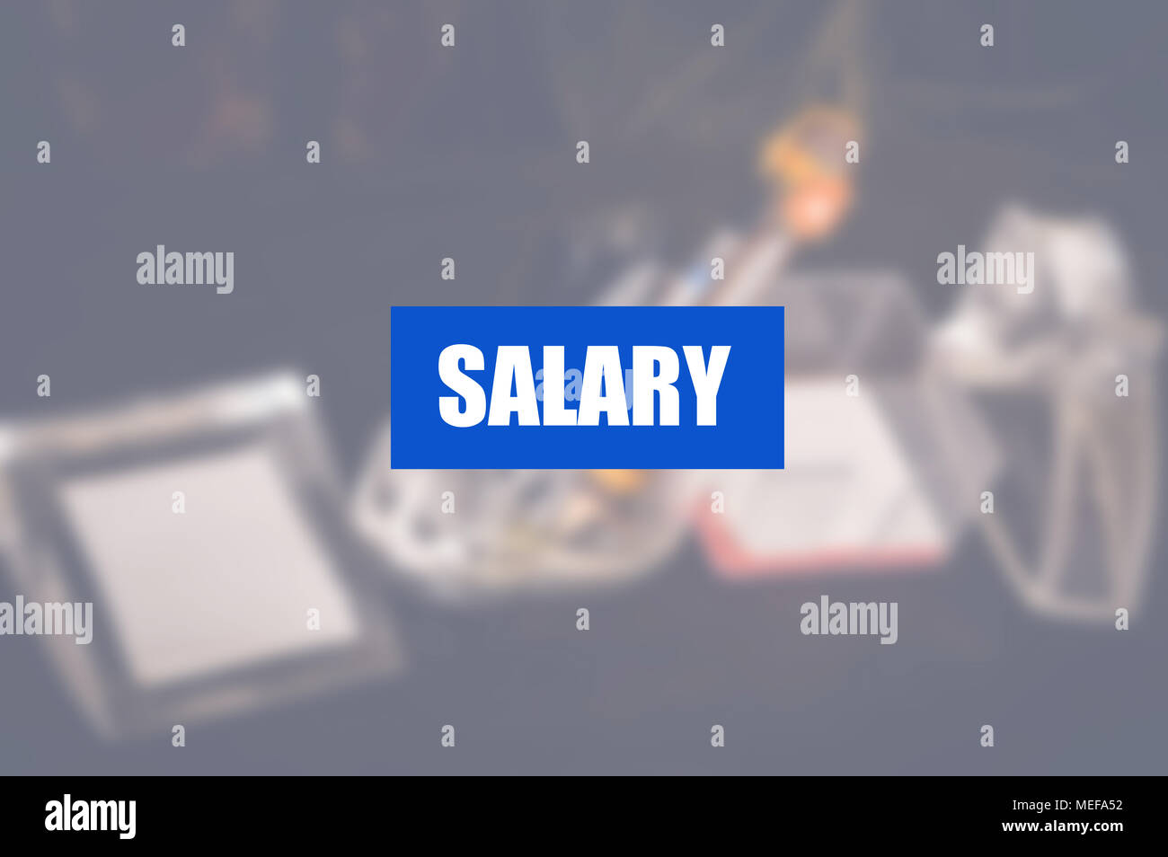 Salary word with business blurring background Stock Photo - Alamy