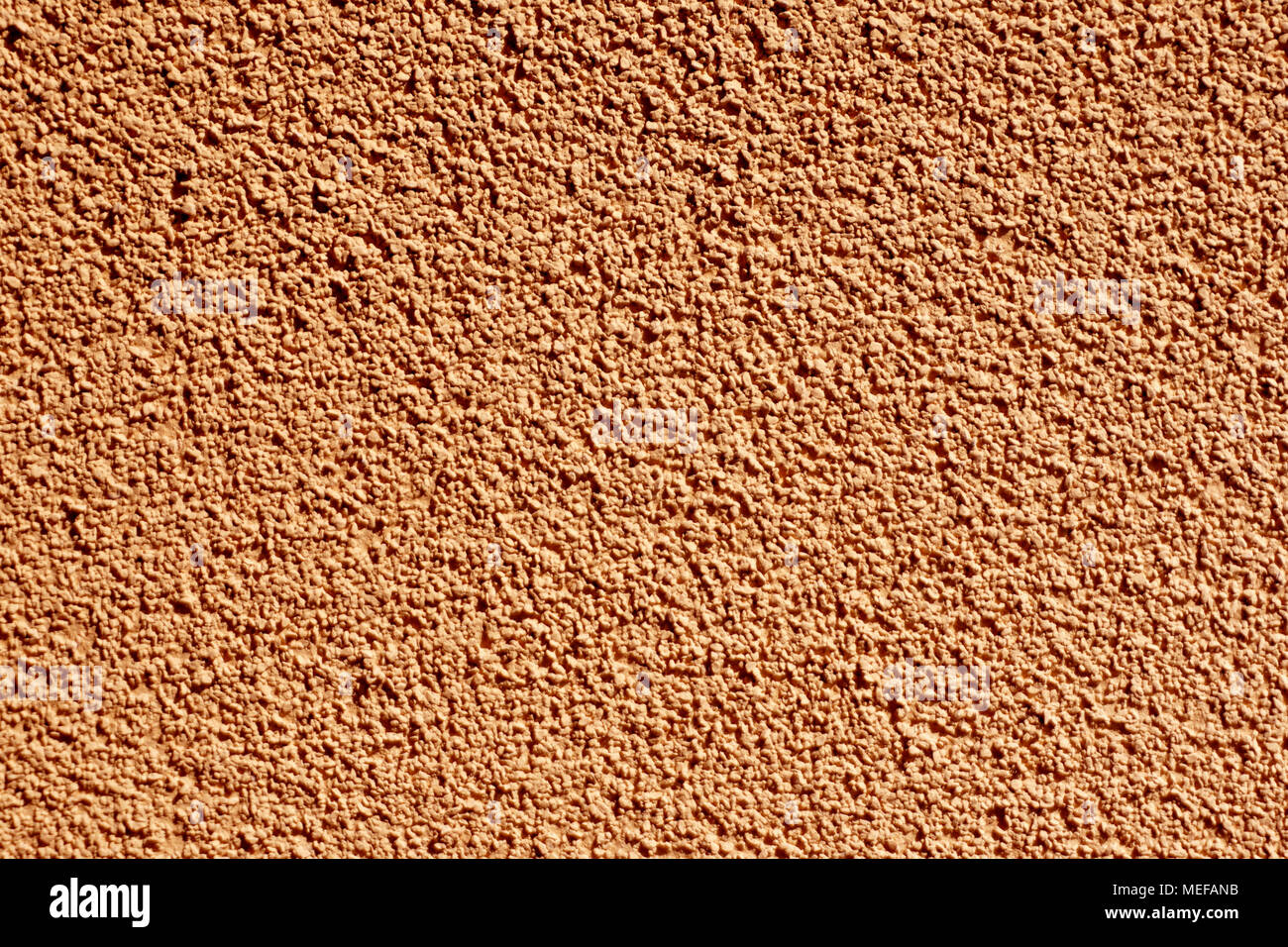 Facade stone plaster background in terracotta color Stock Photo - Alamy