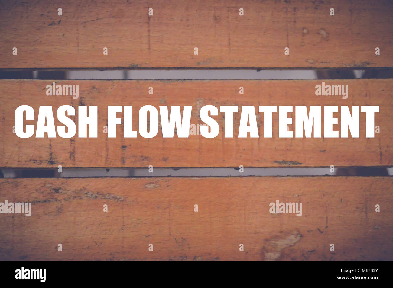 cash flow statement written on wood background Stock Photo - Alamy