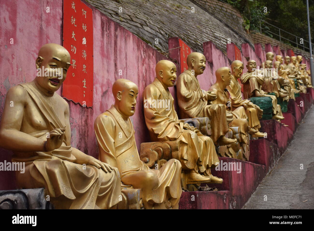 Golden statues inside the Ten thousand Buddhas Monastery in Sha Tin ...