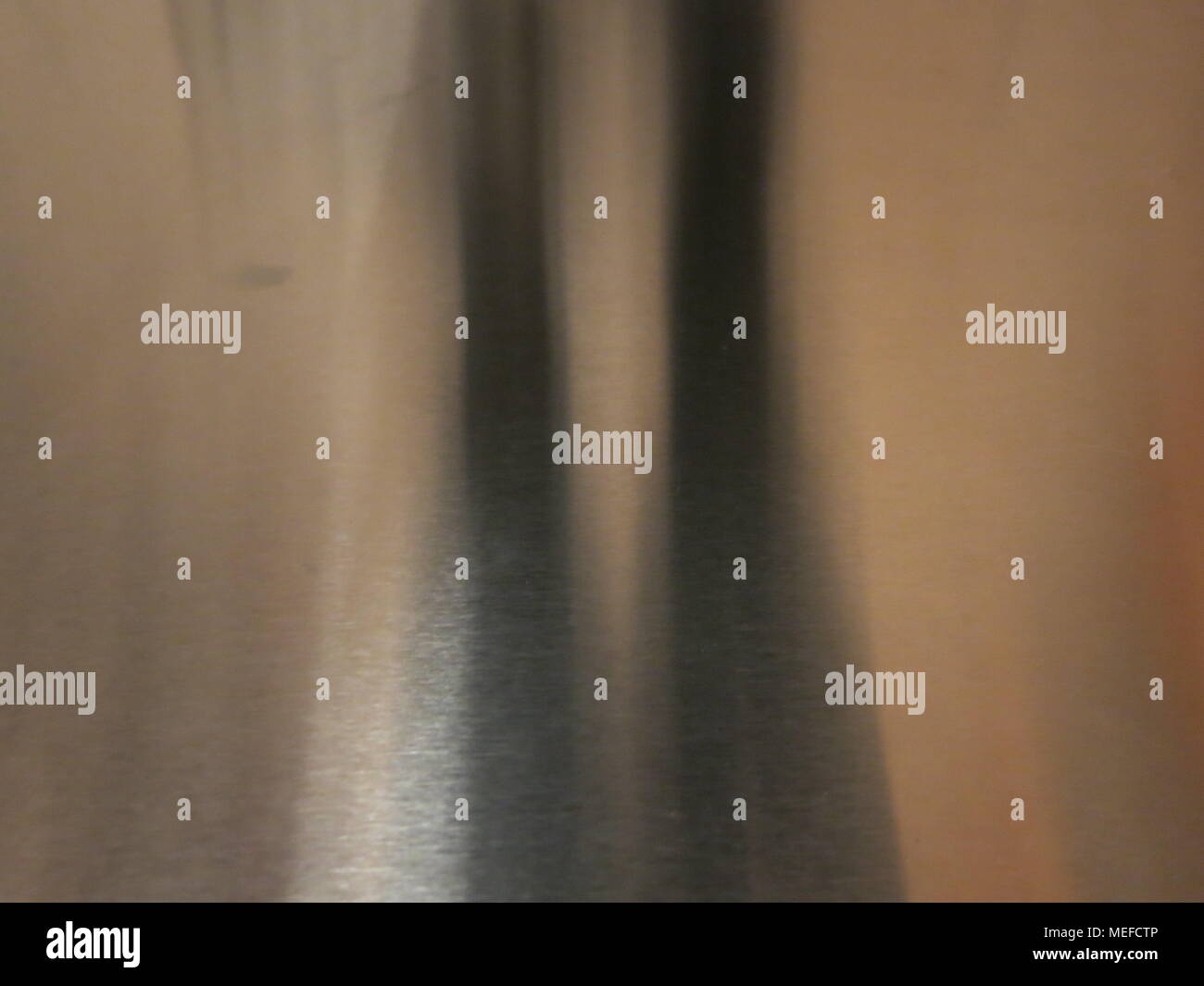 Reflection of a person on shiny inox surface Stock Photo - Alamy