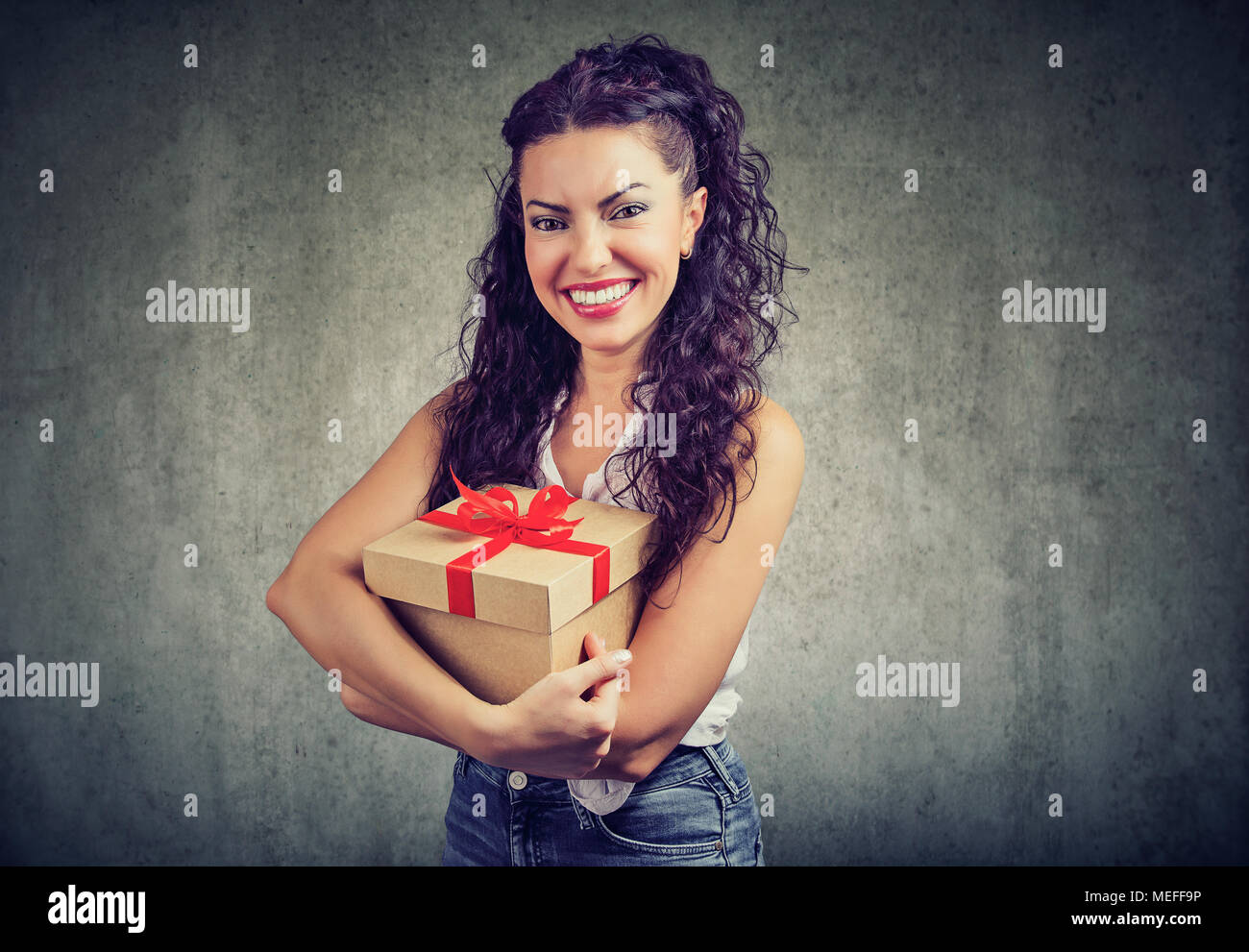 Woman smiling happy birthday present hi-res stock photography and ...