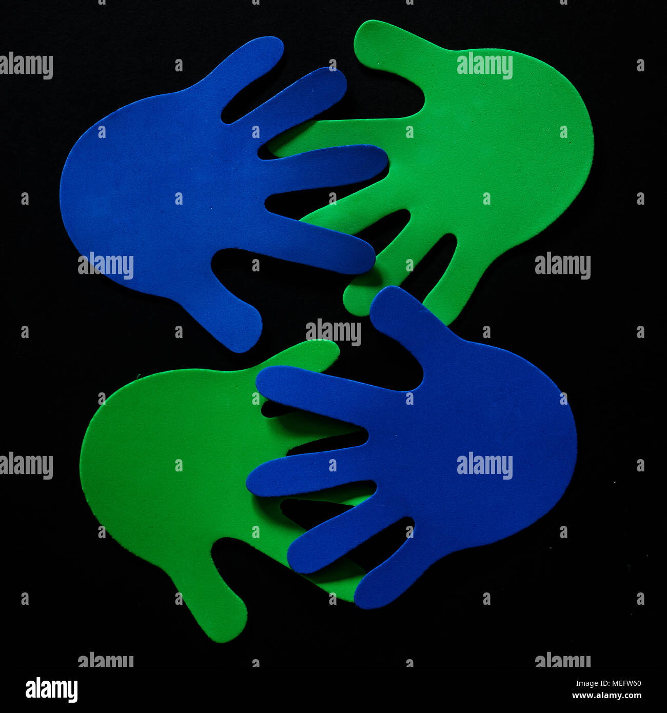 Four hands hi-res stock photography and images - Alamy