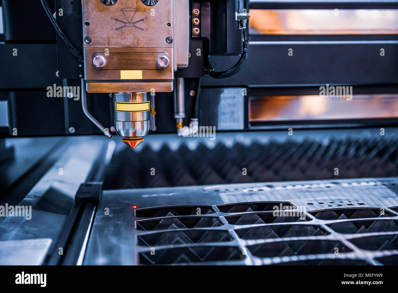 CNC Laser cutting of metal, modern industrial technology. Small depth ...