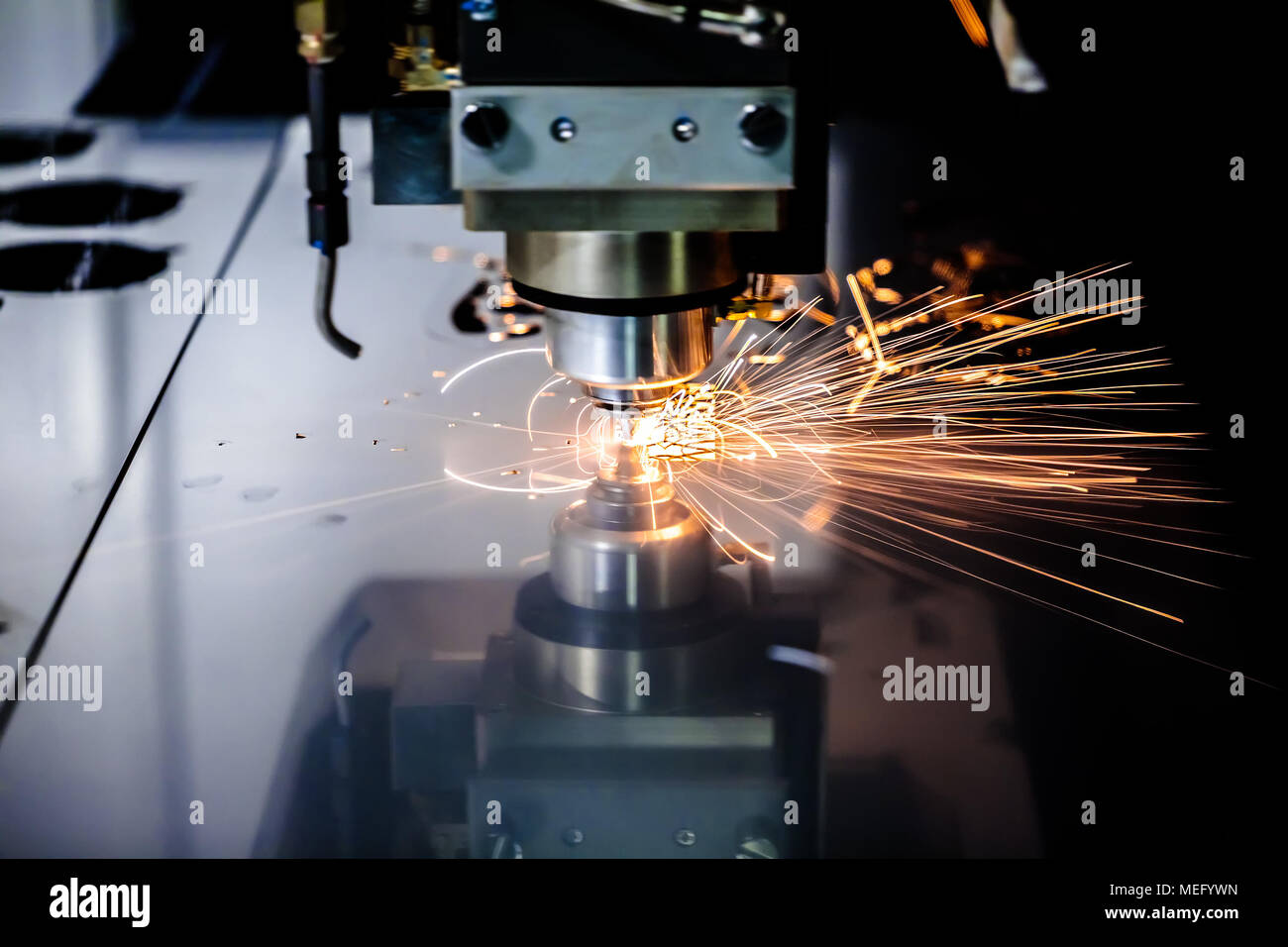 CNC Laser cutting of metal, modern industrial technology. Small depth ...