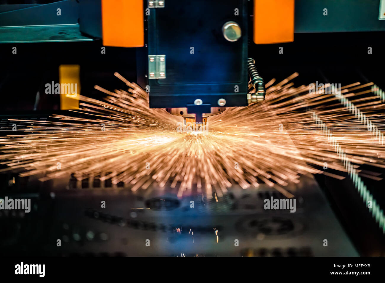 CNC Laser cutting of metal, modern industrial technology. Small depth ...