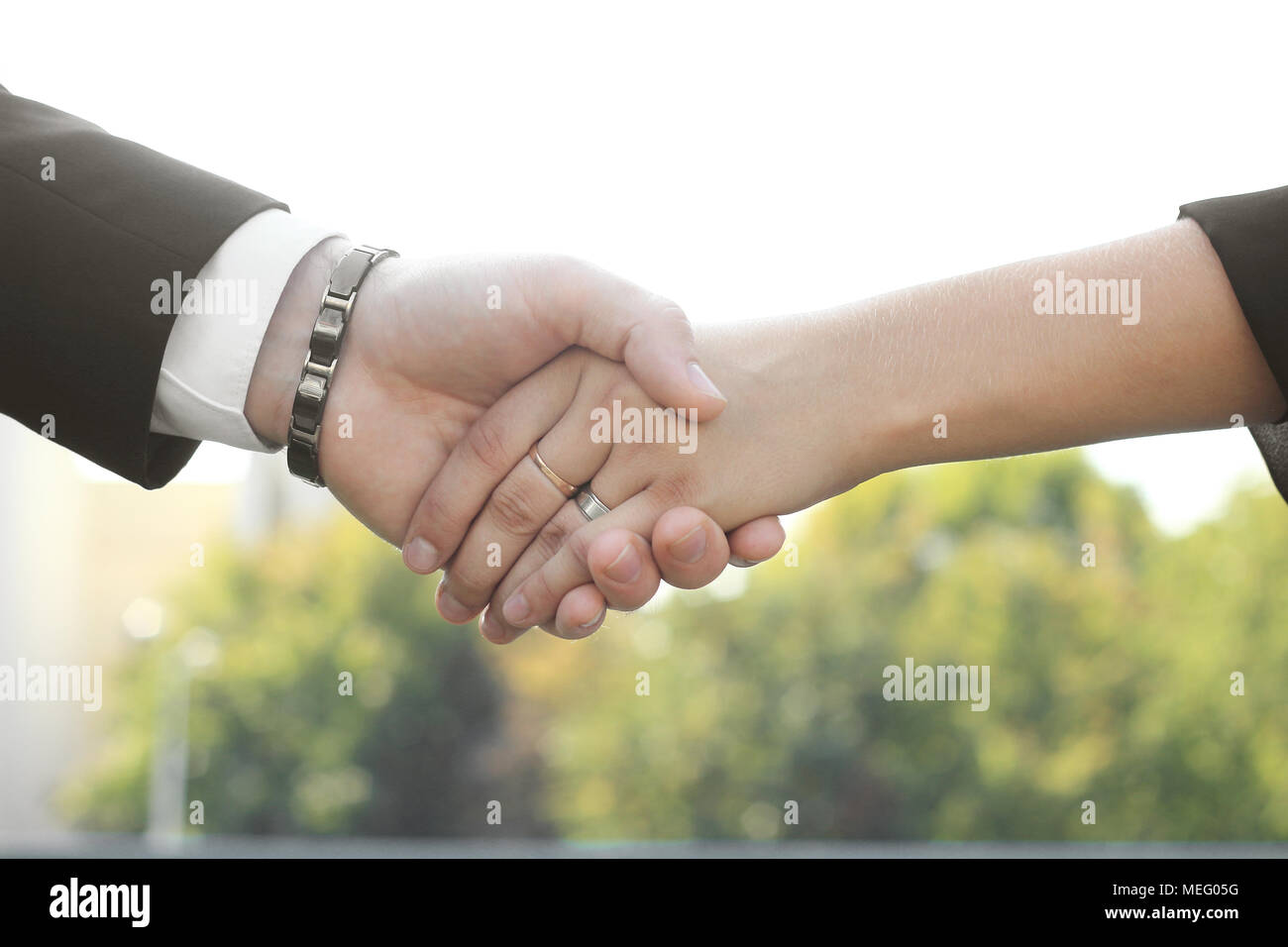 close up. the handshake business partners in the outdoors.photo with ...