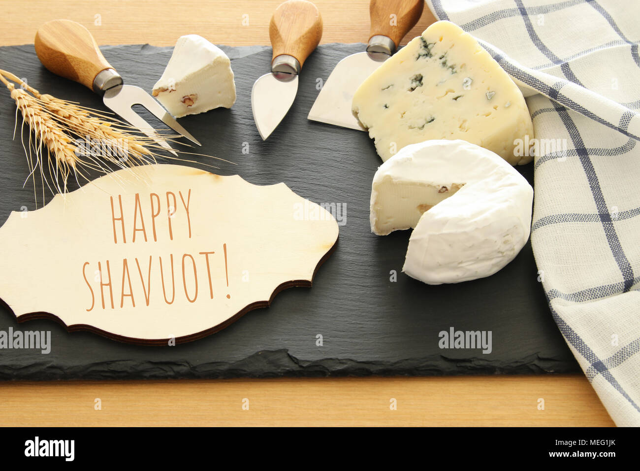 image of dairy products over black stone slate background. Symbols of ...
