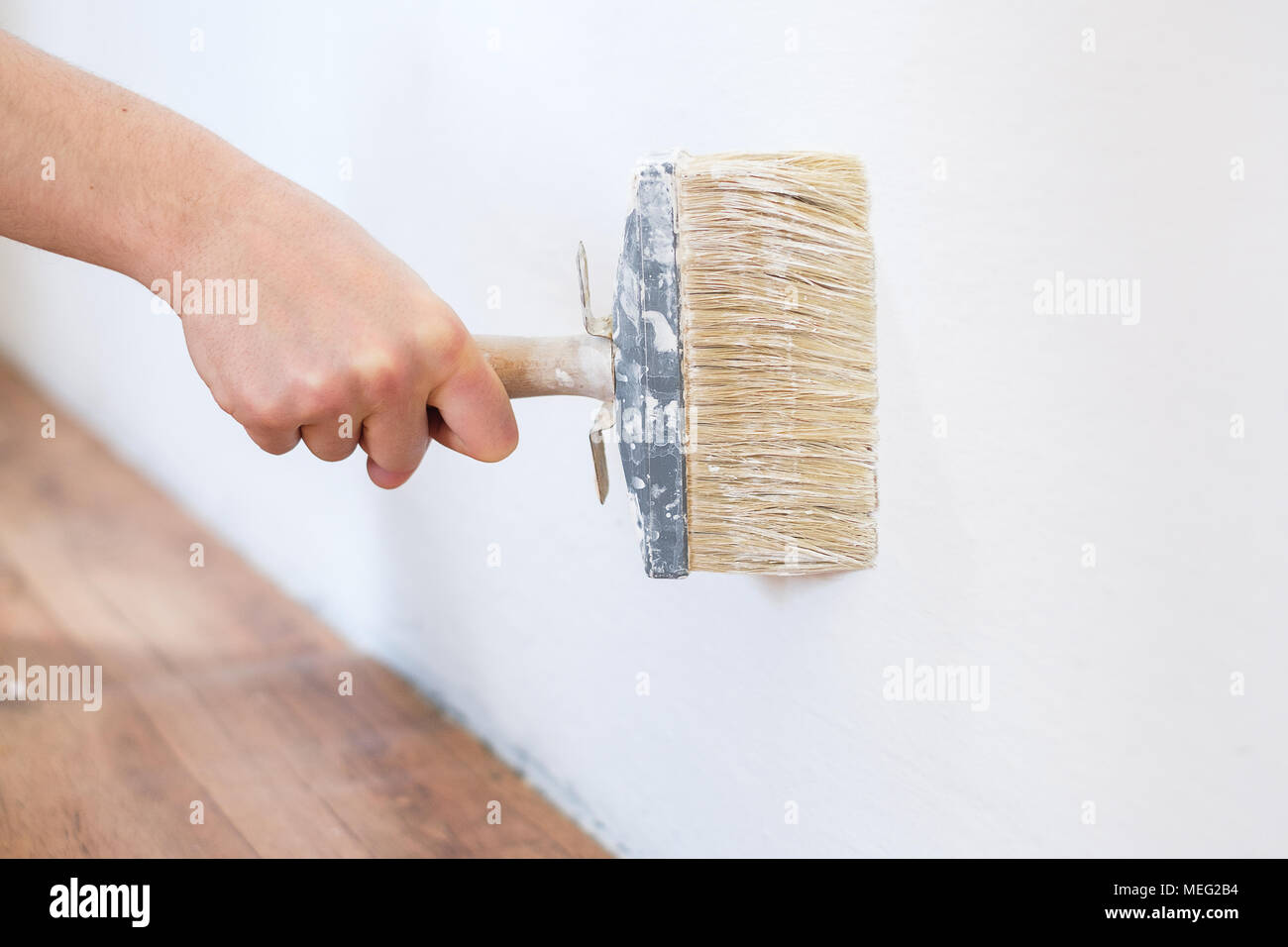 Hand holding roll painter hi-res stock photography and images - Alamy