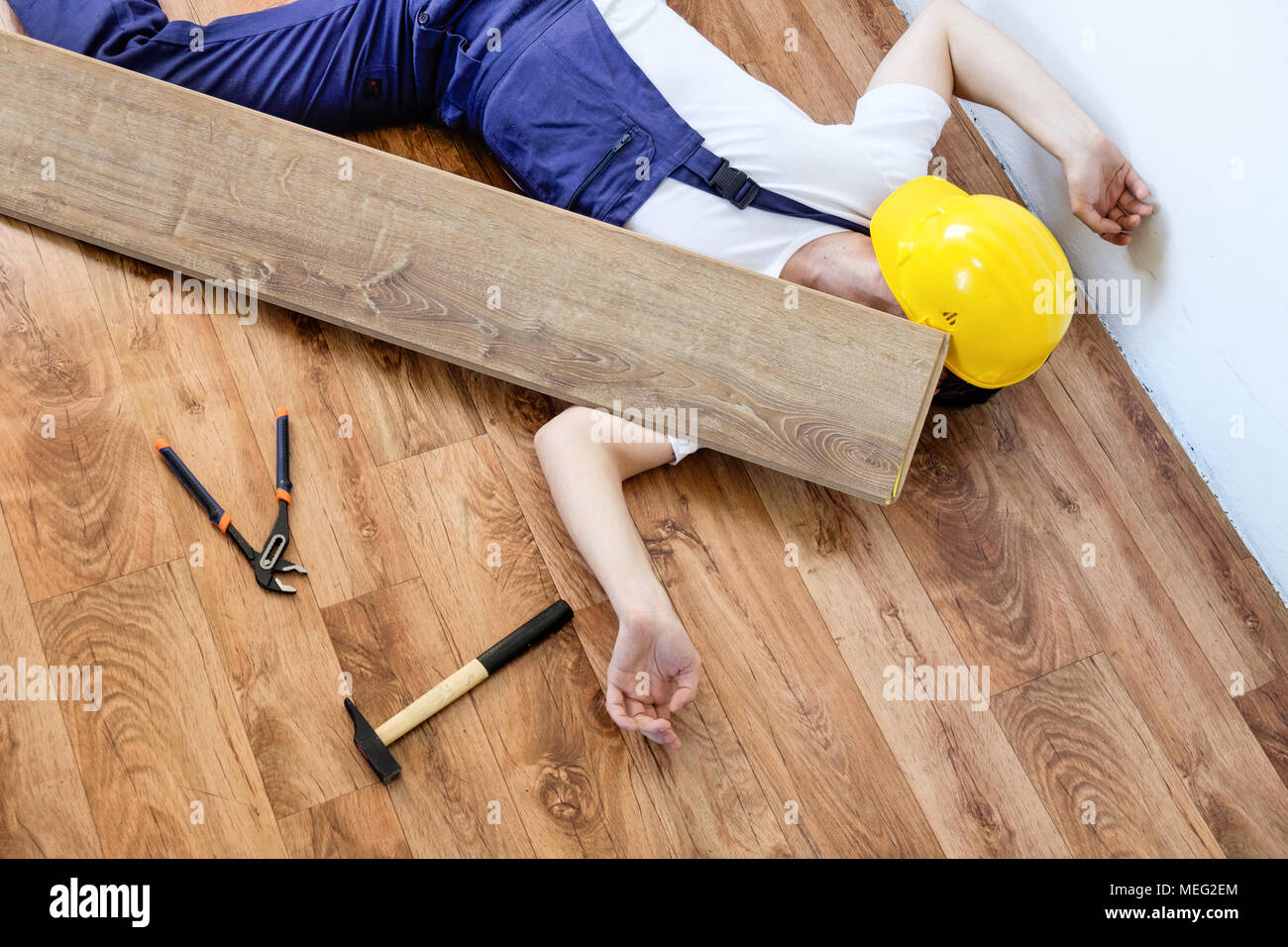 On the job injury of one worker just fallen from a ladder Stock Photo ...
