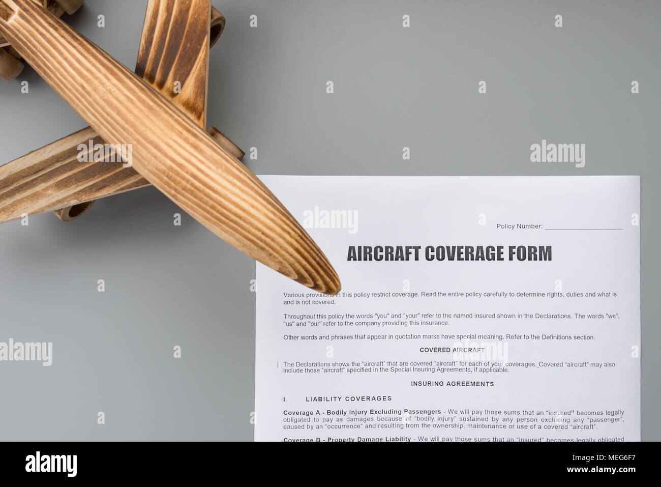 aircraft coverage form and an airplane model close up concept of travel ...