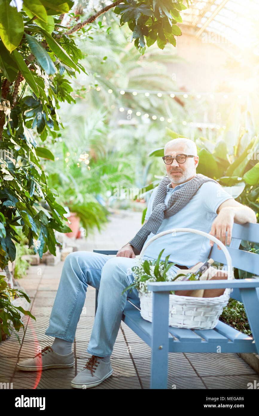 Man on bench Stock Photo - Alamy