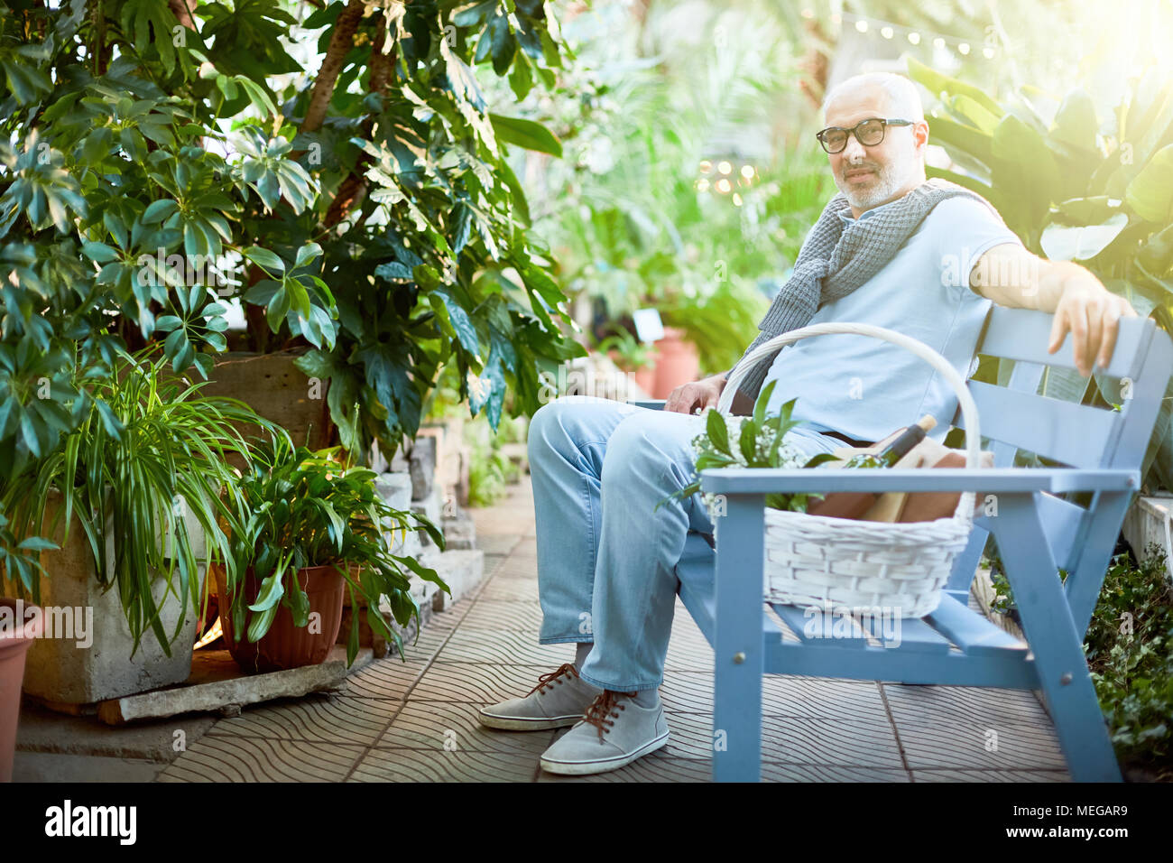 Relaxing on bench Stock Photo - Alamy