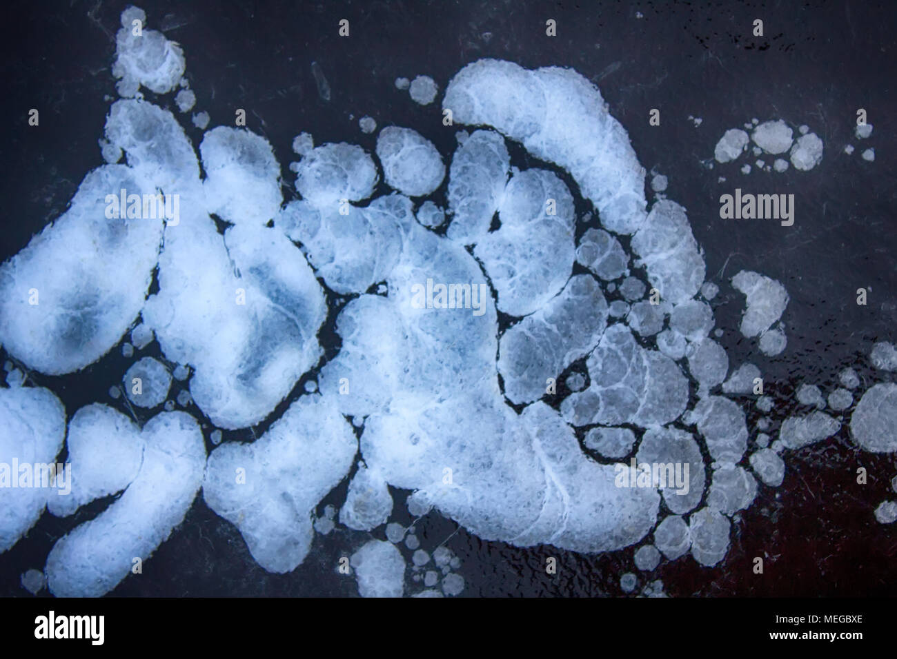 background ice beautiful after a heavy frost. frozen in ice cavity with ...