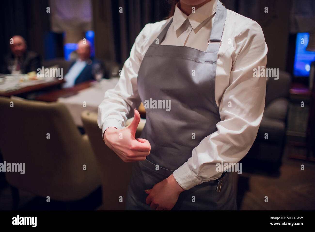 the waiter Hand in mittens show gesture ok Stock Photo - Alamy
