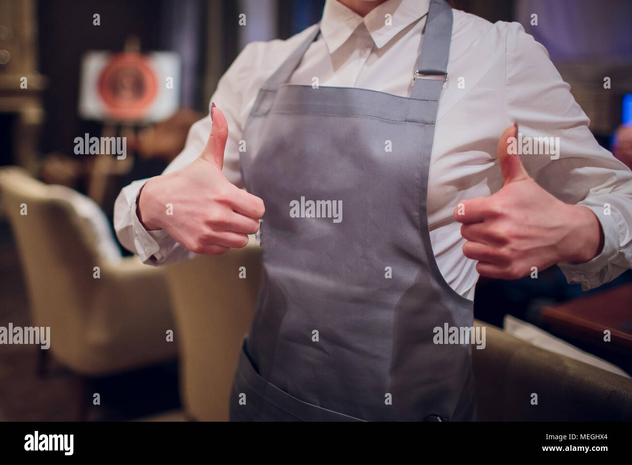 Showing thumbs up to waiter hi-res stock photography and images - Alamy