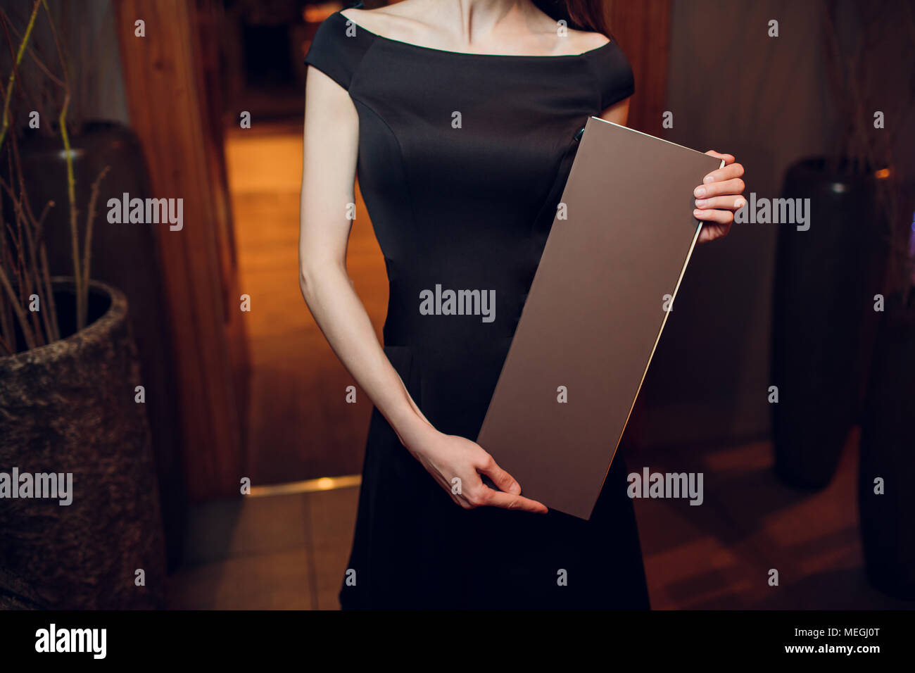 Cropped image of customer asking hostess about food in menu Waitress ...