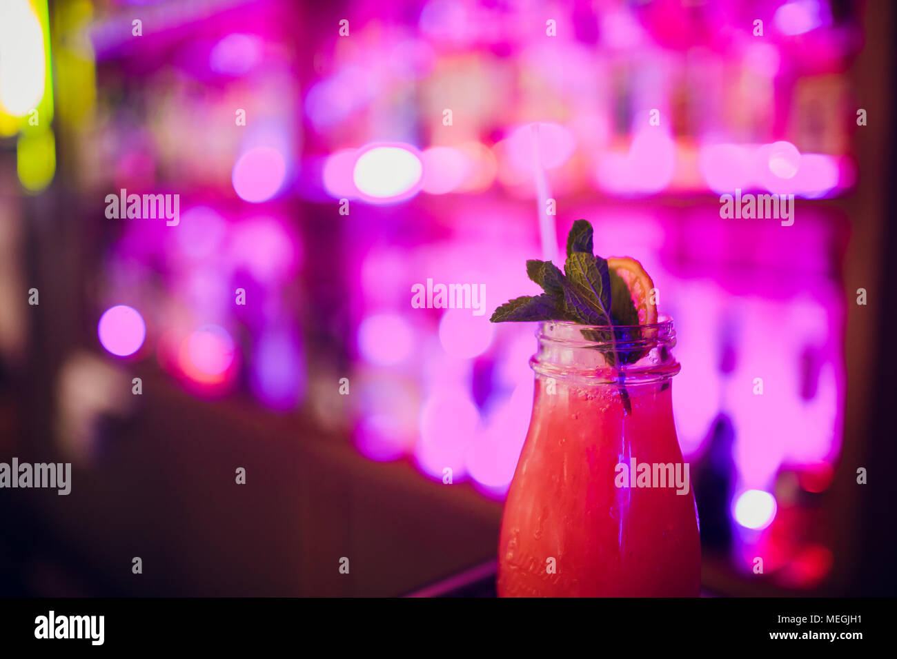 Glasses of cocktails on bar background color drink Stock Photo - Alamy