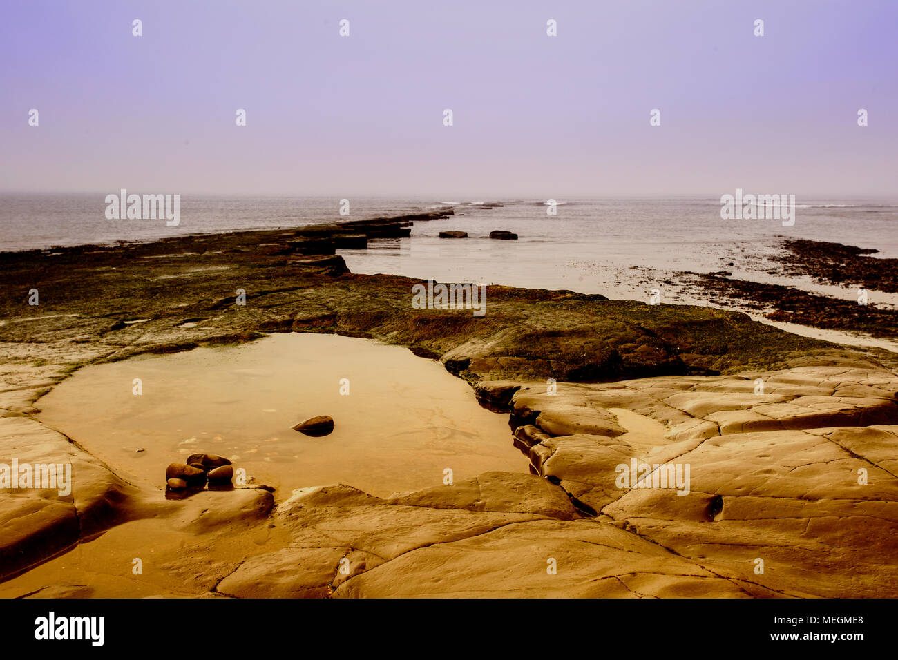 A landscape view of Kimmeridge Bay, Dorset, England enhanced with a ...