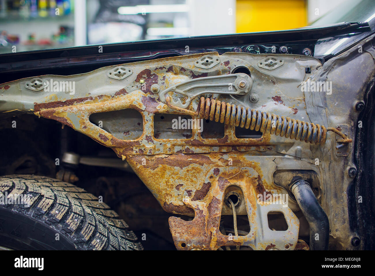Old and rusty car's suspension, which removes the wheels for repair ...