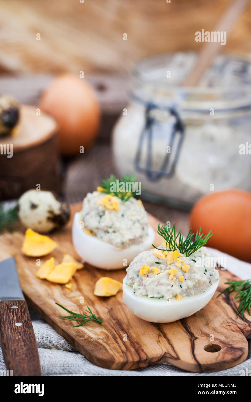 Eggs stuffed with herring creamy pate on wooden rustic background Stock ...
