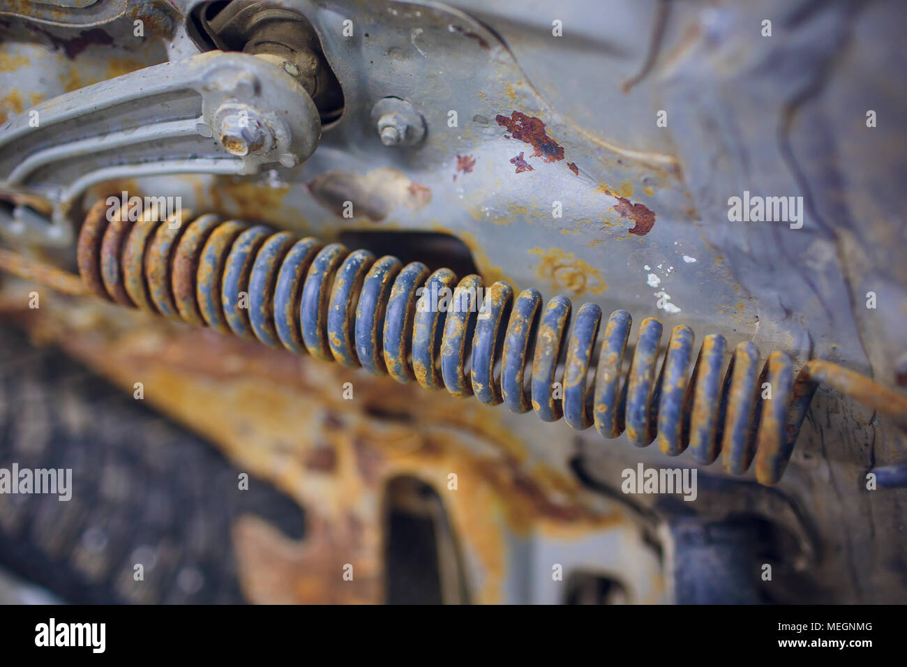Old and rusty car's suspension, which removes the wheels for repair ...